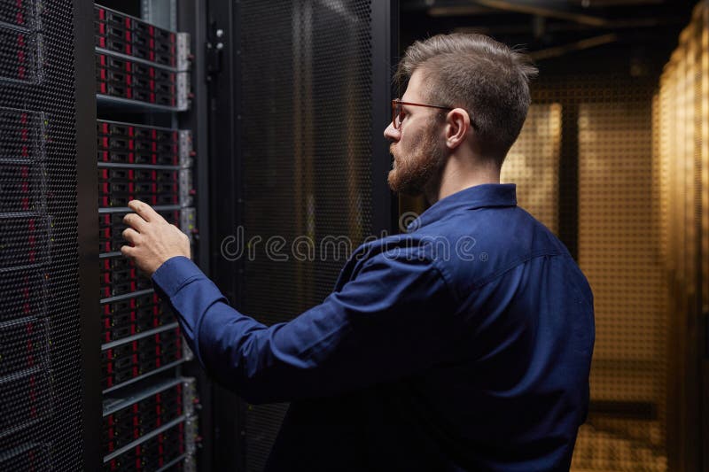 Technician Inspecting Server Rack in Data Center Stock Photo - Image of ...