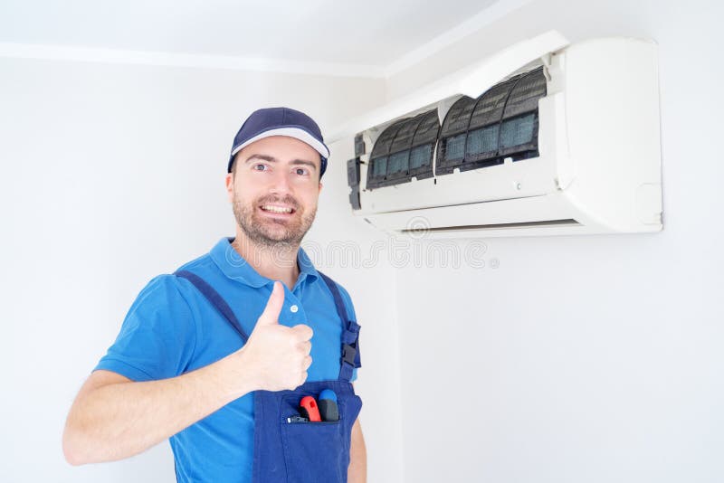 Technician Installing Air Conditioner on the Wall at Home for Hvac ...