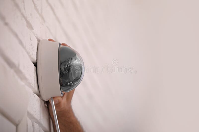 Technician Installing CCTV Camera on Wall. Space for Text Stock Image ...