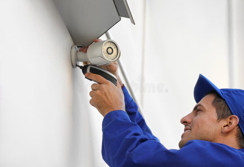 Technician Installing CCTV Camera on Wall Stock Photo - Image of fixing ...