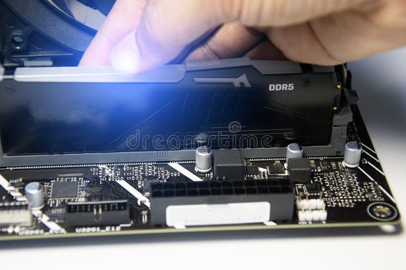 The Technician is Installing DDR5 RAM Onto the Motherboard Stock Image ...
