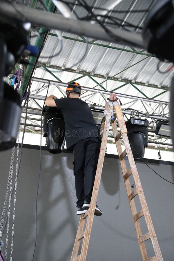 221 Man Hang Lights Stock Photos - Free & Royalty-Free Stock Photos ...