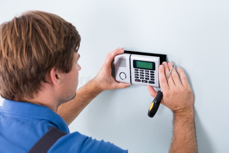 Technician Installing Security System Using Screwdriver Stock Image ...