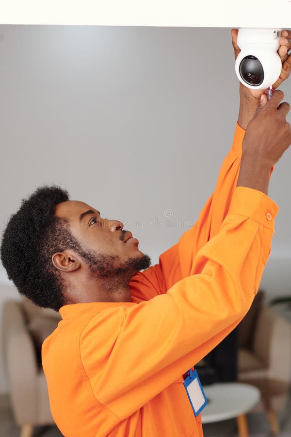 Black Man Installing Security Camera Photos - Free & Royalty-Free Stock ...