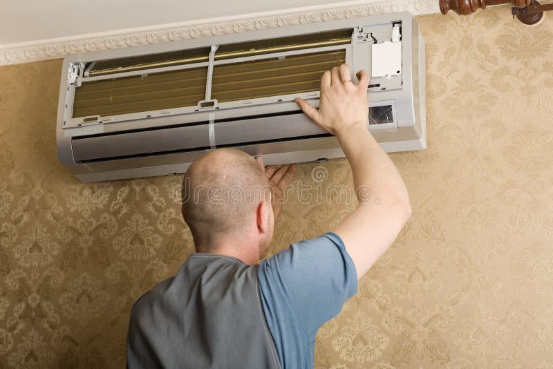 Adjuster Sets a New Air Conditioner Stock Image - Image of installer ...