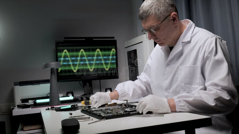Technician Repairs Circuit Board while Analyzing Signals in Laboratory ...