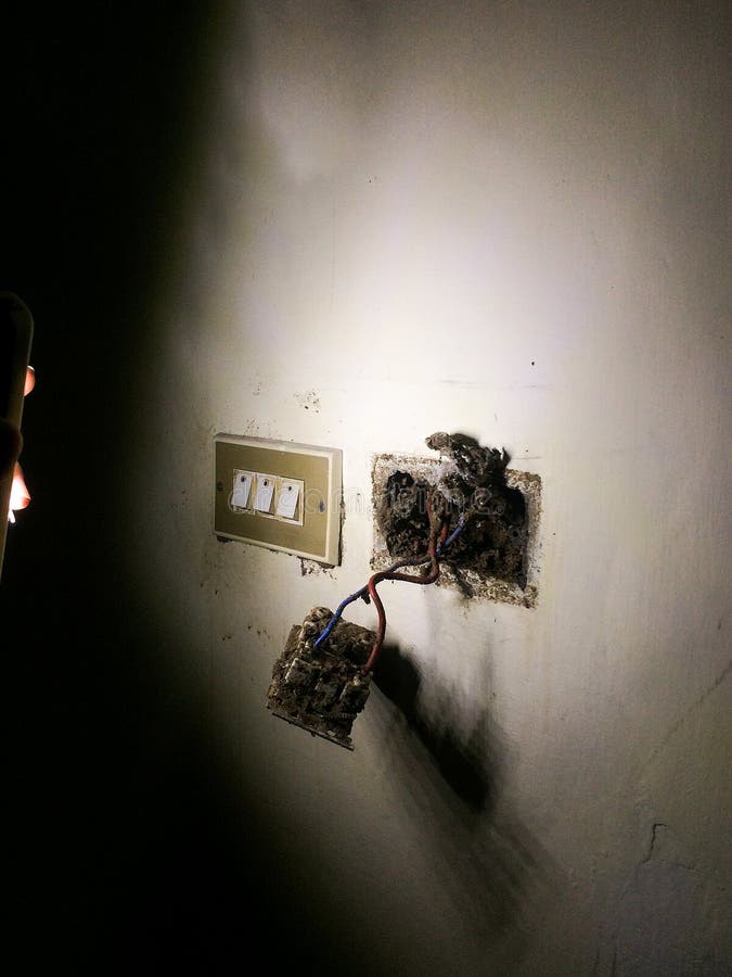 A Technician Lighting a Broken Light Switch in the Dark Stock Photo ...