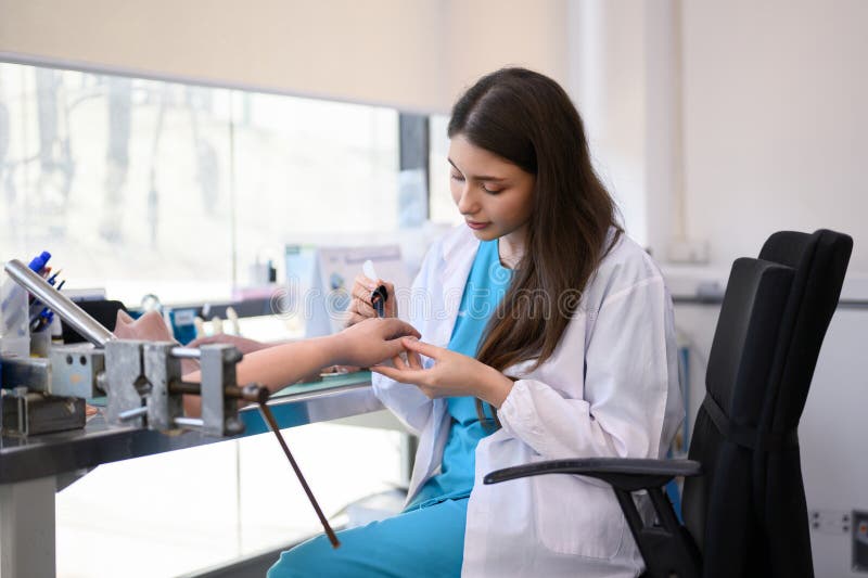 Technician Making Prosthetic Device Using Grinder To Smooth Socket ...