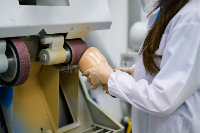Technician Making Prosthetic Limb Using Grinder To Smooth Socket Stock ...