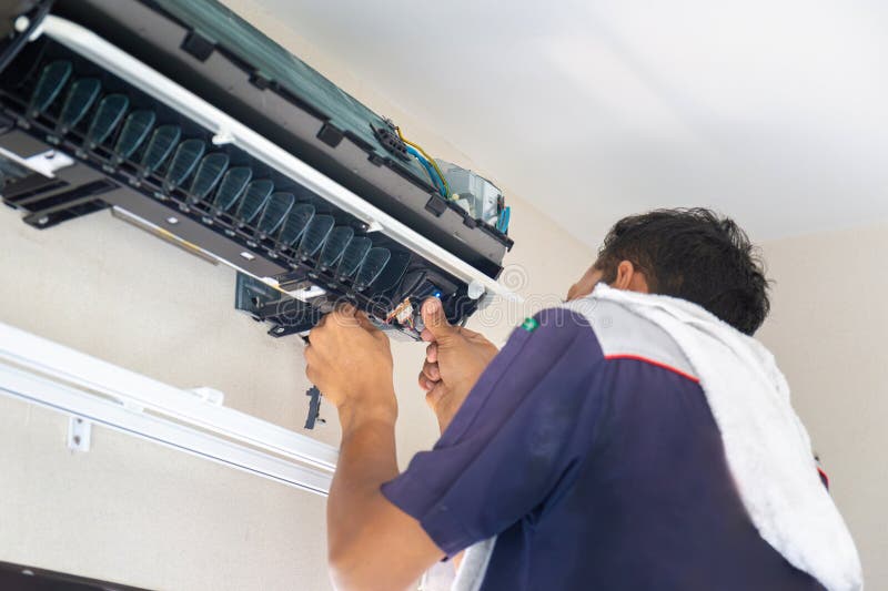 Technician Man Fixing and Clean Air Conditioning System, Maintenance ...