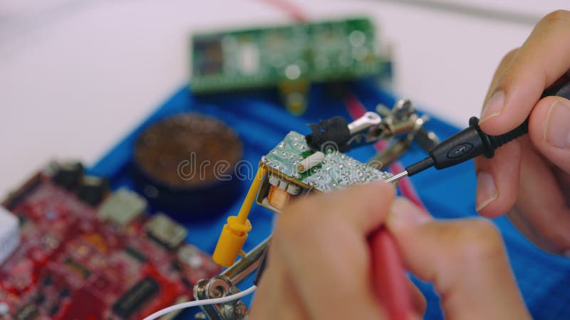 Technician Man S Hand Measuring Electrical Voltage of Mainboard Using ...