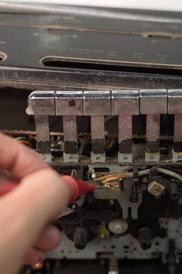 A Technician Measuring Voltage at Cassette Tape Reader Head Stock Photo ...