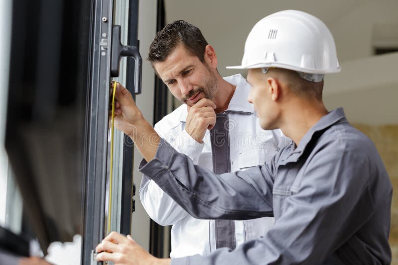 Technician Measuring Window with Teacher Stock Photo - Image of plywood ...