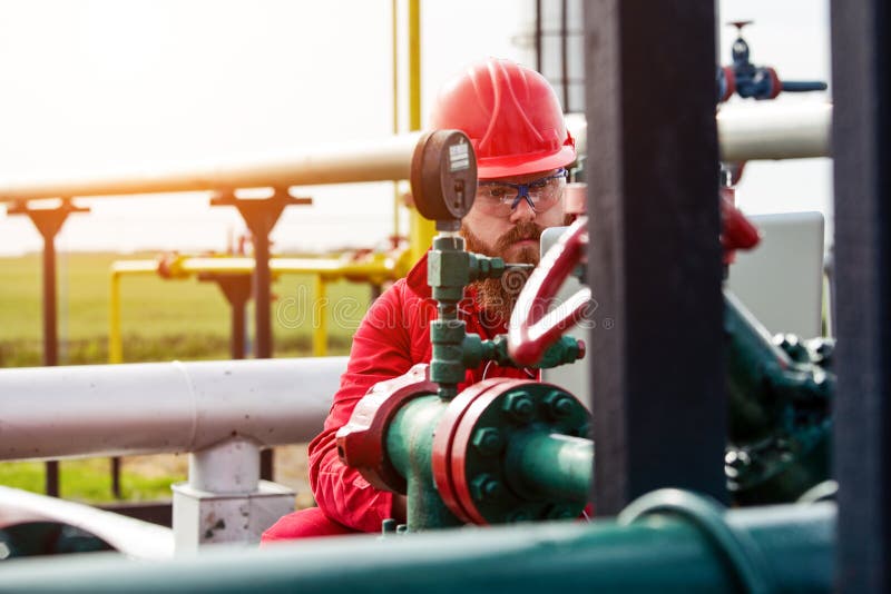 Technician in Oil and Gas Refinery. Worker in Oil Refinery Stock Photo ... Technician in Oil and Gas Refinery. Worker in Oil Refinery Stock Photo ...