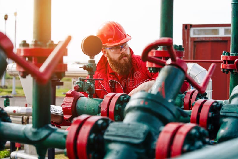Technician in Oil and Gas Refinery. Worker in Oil Refinery Stock Photo ... Technician in Oil and Gas Refinery. Worker in Oil Refinery Stock Photo ...