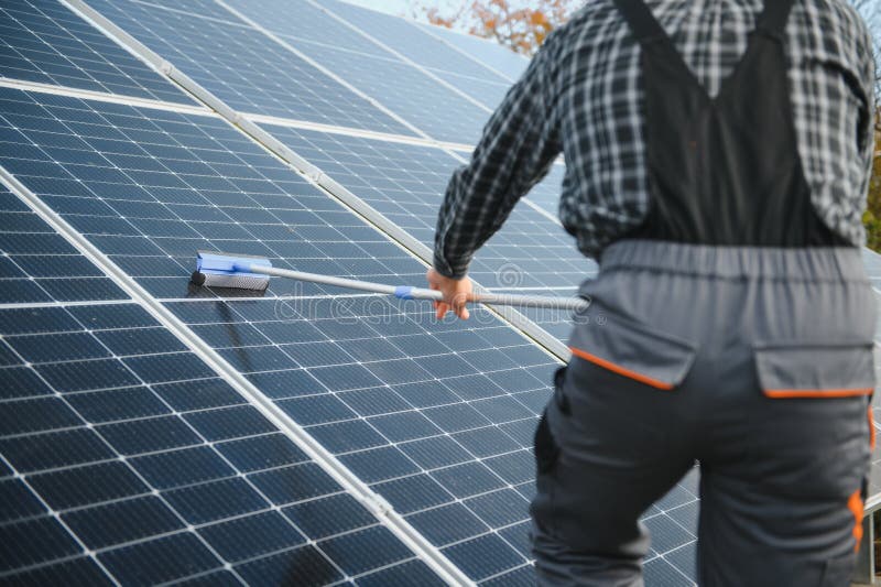 Technician Operating and Cleaning Solar Panels at Generating Power of ... Technician Operating and Cleaning Solar Panels at Generating Power of ...