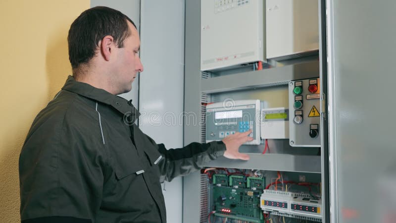 Technician Operating Electrical Control Panel, Male Technician ...
