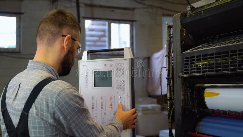 Technician Operator Checking Input and Output Status on Touchscreen Front Display Monitor ...