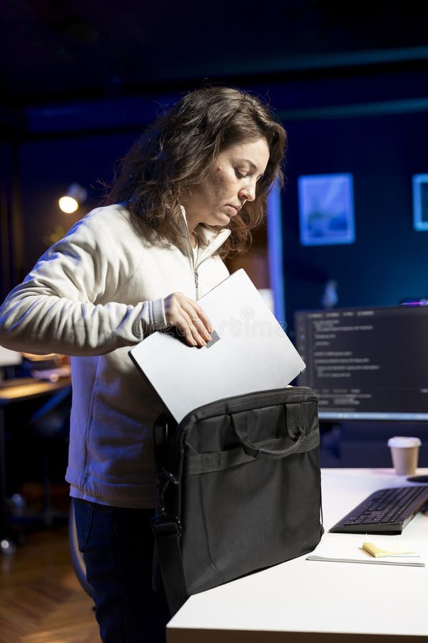 Woman Putting Notebook in Backpack, Leaving Office Stock Image - Image ...