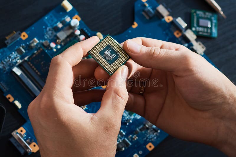 Technician Plug in CPU Microprocessor To Computer Motherboard Stock ...