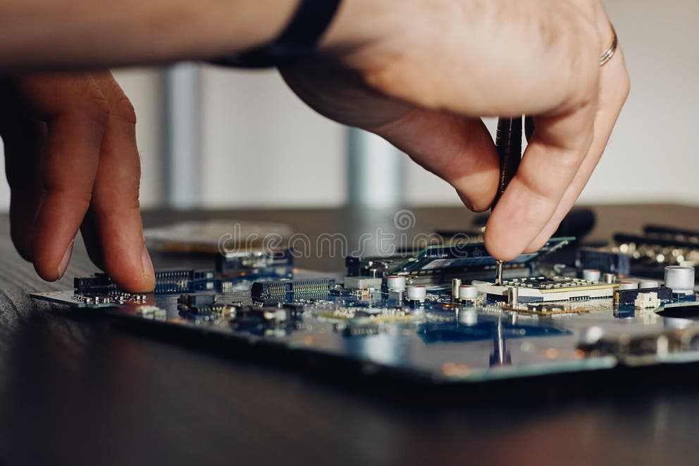 Technician Plug in CPU Microprocessor To Computer Motherboard Stock ...