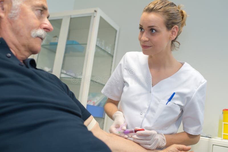 Technician Prepping Patient for Blood Test Stock Image - Image of ...
