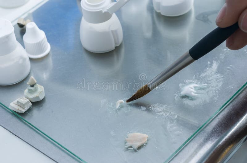 Technician Putting the Ceramic Material in Powder in the Glass. Stock ...