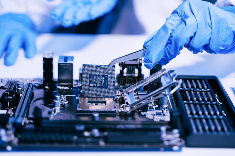 The Technician is Putting the CPU on the Socket of the Computer ...