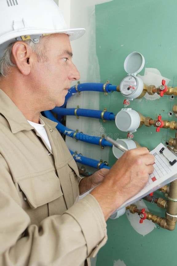 Technician Reading Water Meter Stock Image - Image of happy, monitoring ...