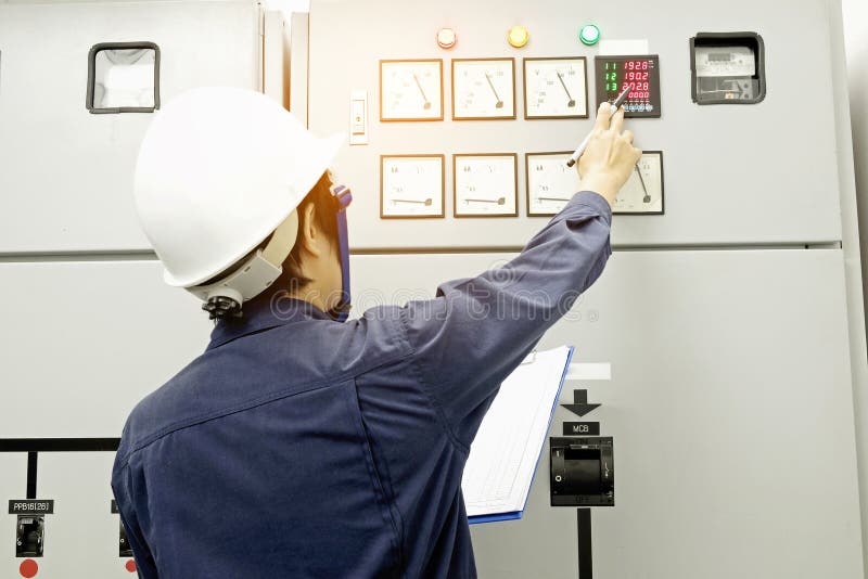 Technician is Recording Data Voltage or Current in Control Panel Stock ...
