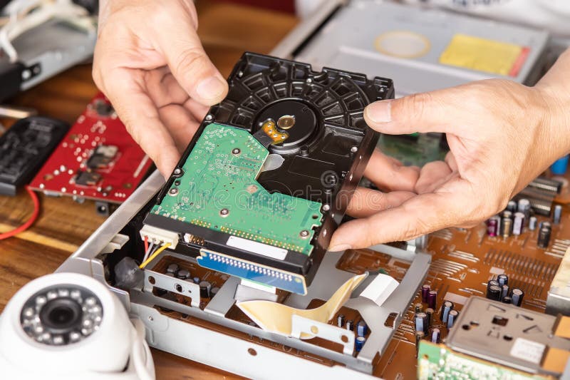 Technician Remove a Hard Disk Drive from the CCTV DVR Recorder Case, To ... Technician Remove a Hard Disk Drive from the CCTV DVR Recorder Case, To ...