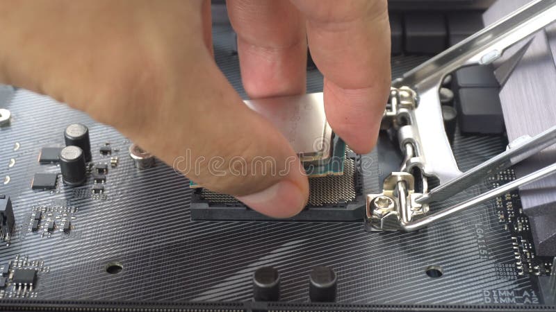 Technician Removing and Replacing in CPU Microprocessor To Motherboard ...