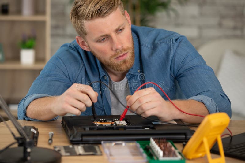 Man Testing Broken Laptop with Multimeter Stock Image - Image of ...