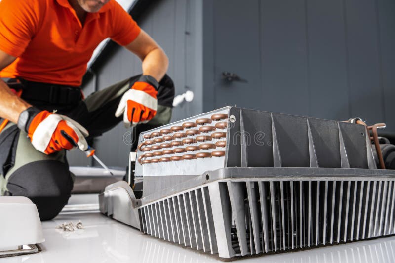Technician Repairing Air Conditioner Unit on a Camper Van Rooftop Stock ...