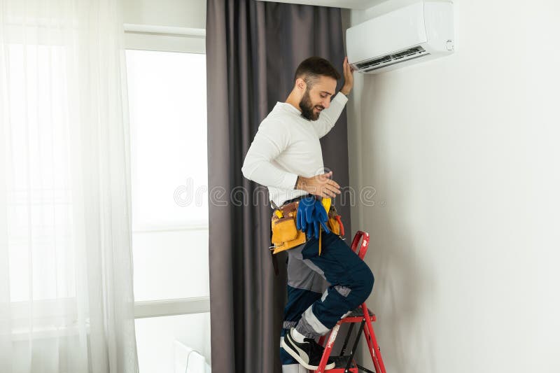 Technician Repairing Air Conditioner on the Wall Stock Photo - Image of ...