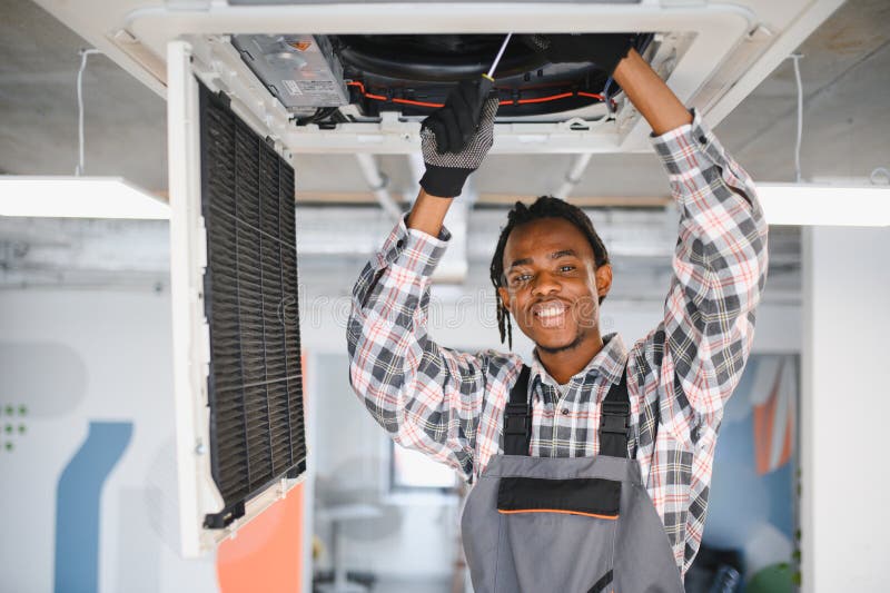 Technician Repairing Air Conditioning System with Screwdriver Stock ...