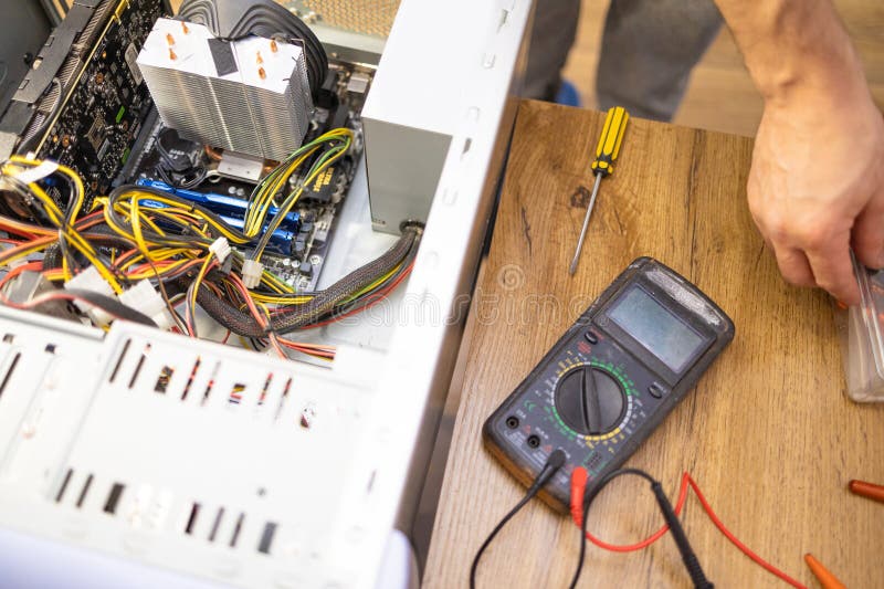 Technician Repairing a Broken Computer in a Workshop, Close-up Stock ...