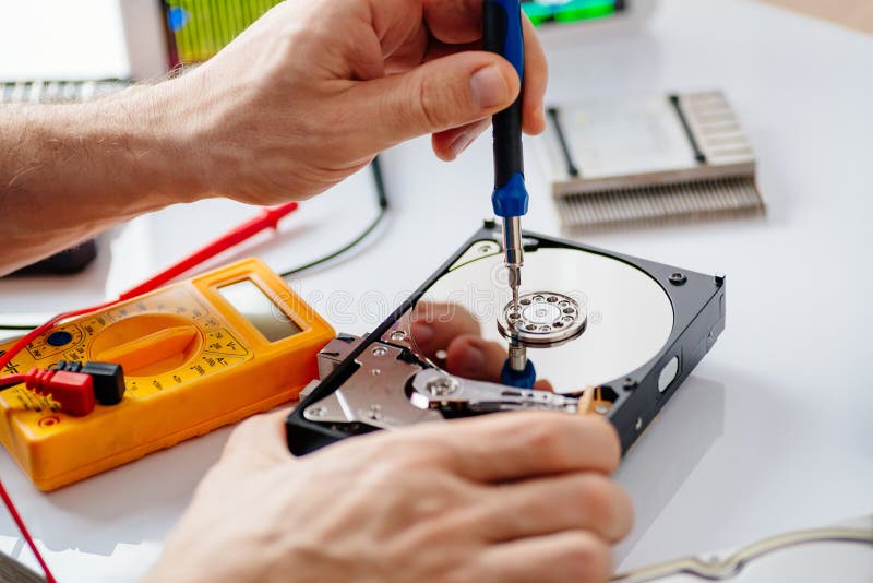 Technician Repairing Broken Hard Disk Drive. Stock Image - Image of ... Technician Repairing Broken Hard Disk Drive. Stock Image - Image of ...