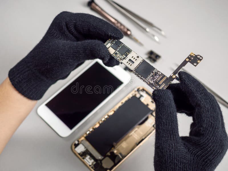 Technician Repairing Broken Smartphone on Desk Stock Photo - Image of ...