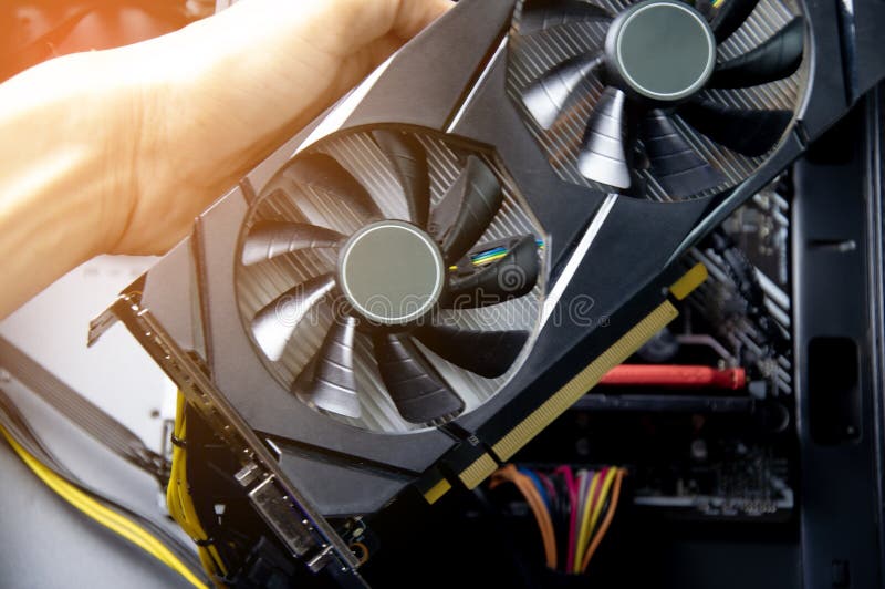 Technician Repairing Computer Change the Graphics Card in the Computer ...