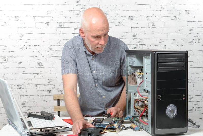 A Technician Repairing a Computer Stock Image - Image of support, young ...