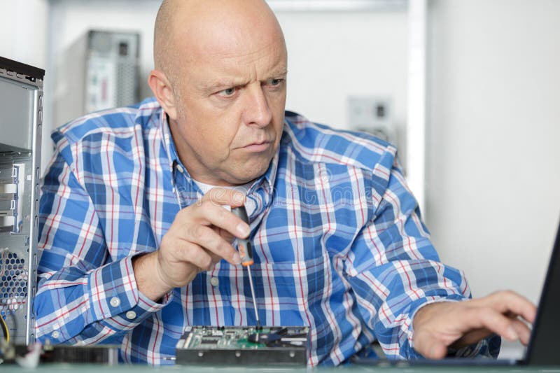 Technician Repairing Computer Hardware in Workshop Stock Image - Image ...