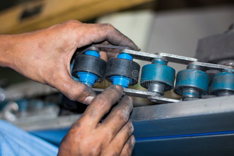 The Technician Repairing Conveyor Belt in Factory. Stock Photo - Image ...