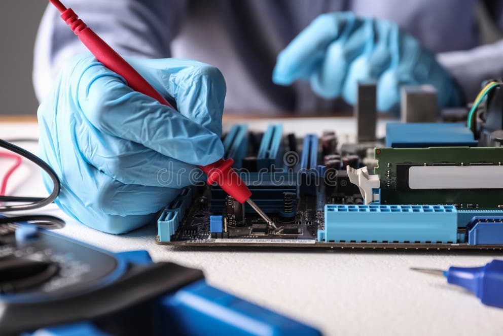 Technician Repairing Electronic Circuit Board at Table, Closeup Stock ...