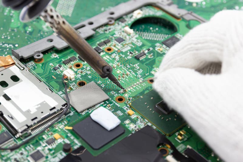 Technician Repairing Electronic of the Computer`s Circuit Board by ... Technician Repairing Electronic of the Computer`s Circuit Board by ...
