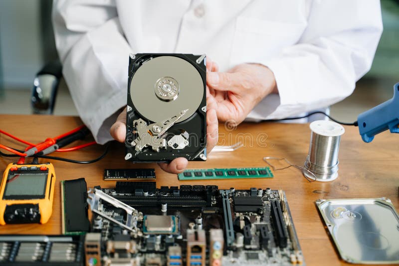 Technician Repairing Inside of Hard Disk Drive by Screwdriver. the ...