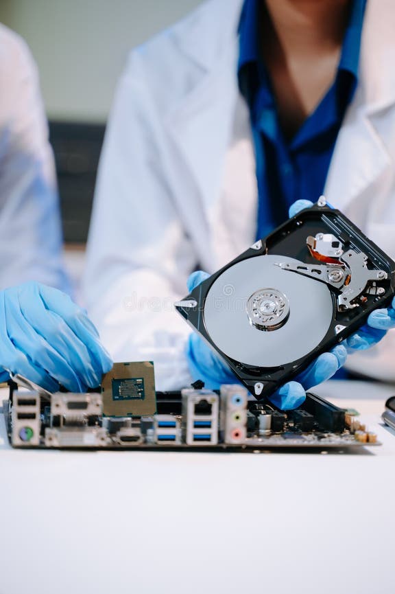 Technician Repairing Inside of Hard Disk Drive by Screwdriver. the ...