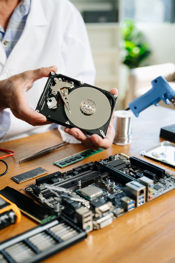 Technician Repairing Inside of Hard Disk Drive by Screwdriver. the ...