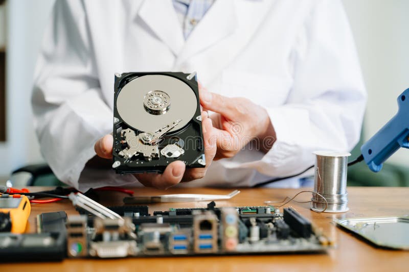 Technician Repairing Inside of Hard Disk Drive by Screwdriver. the ...
