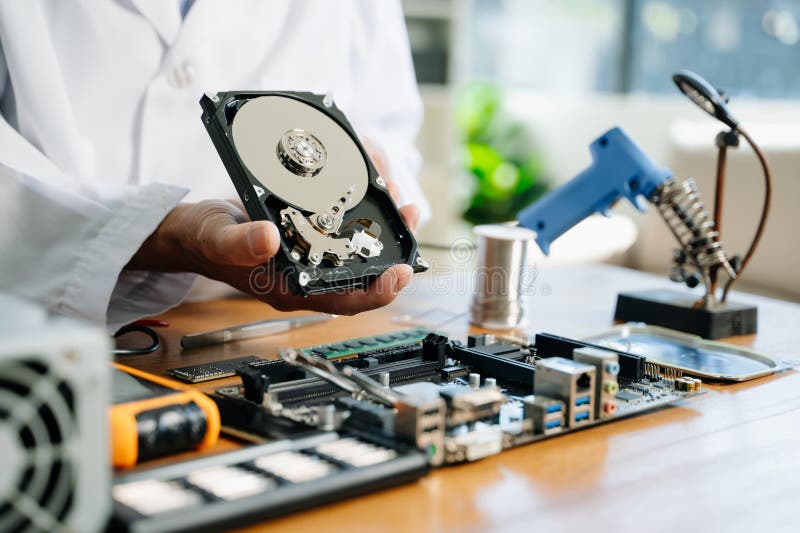Technician Repairing Inside of Hard Disk Drive by Screwdriver. the ...
